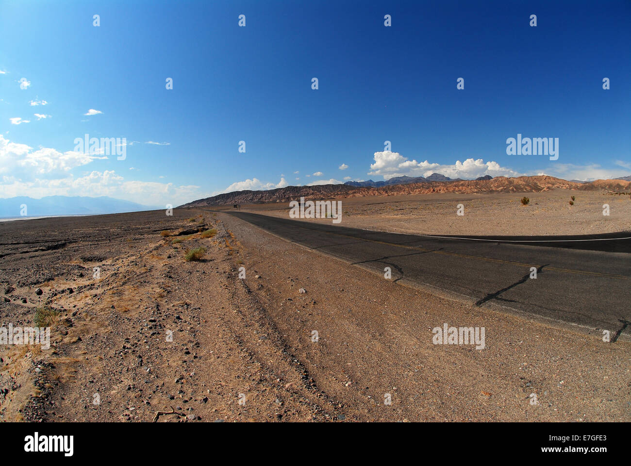 Driving on Death Valley road in the middle of desert landscape Stock ...