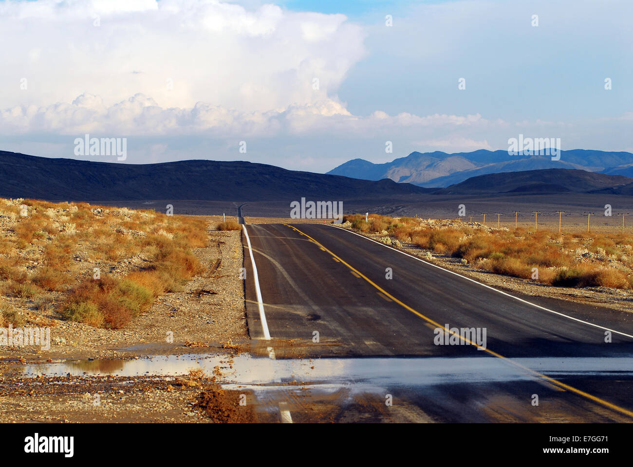 Driving on Death Valley road in the middle of desert landscape Stock ...