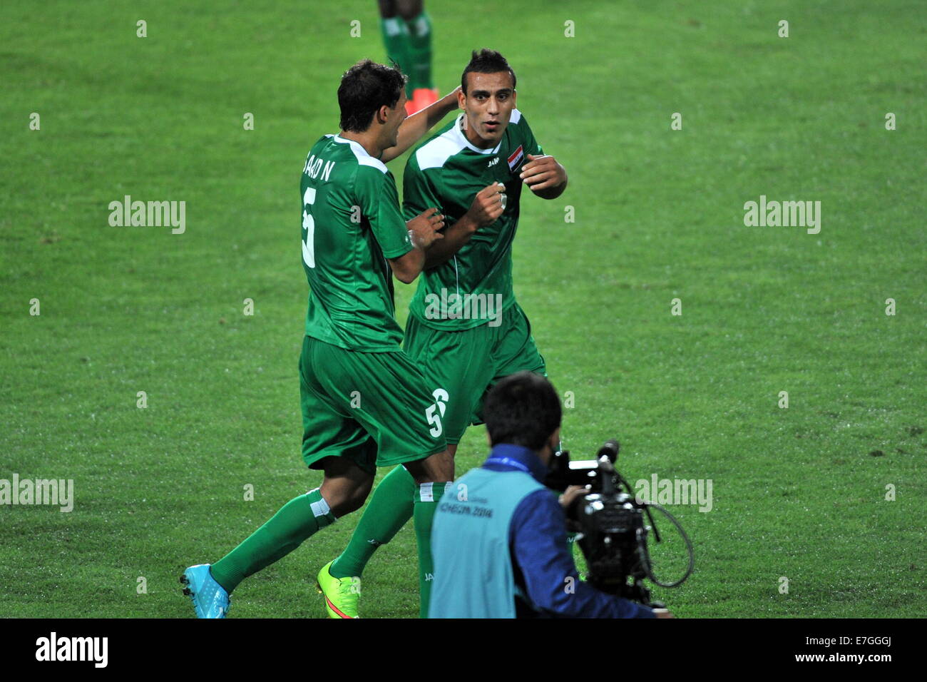 Incheon, South Korea. 17th Sep, 2014. Al Tameemi Ali Adnan Kahim (R) of ...