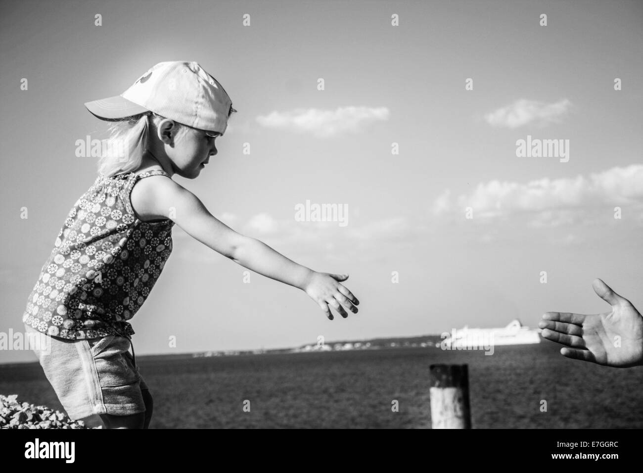 Child reaching for Black and White Stock Photos & Images - Alamy