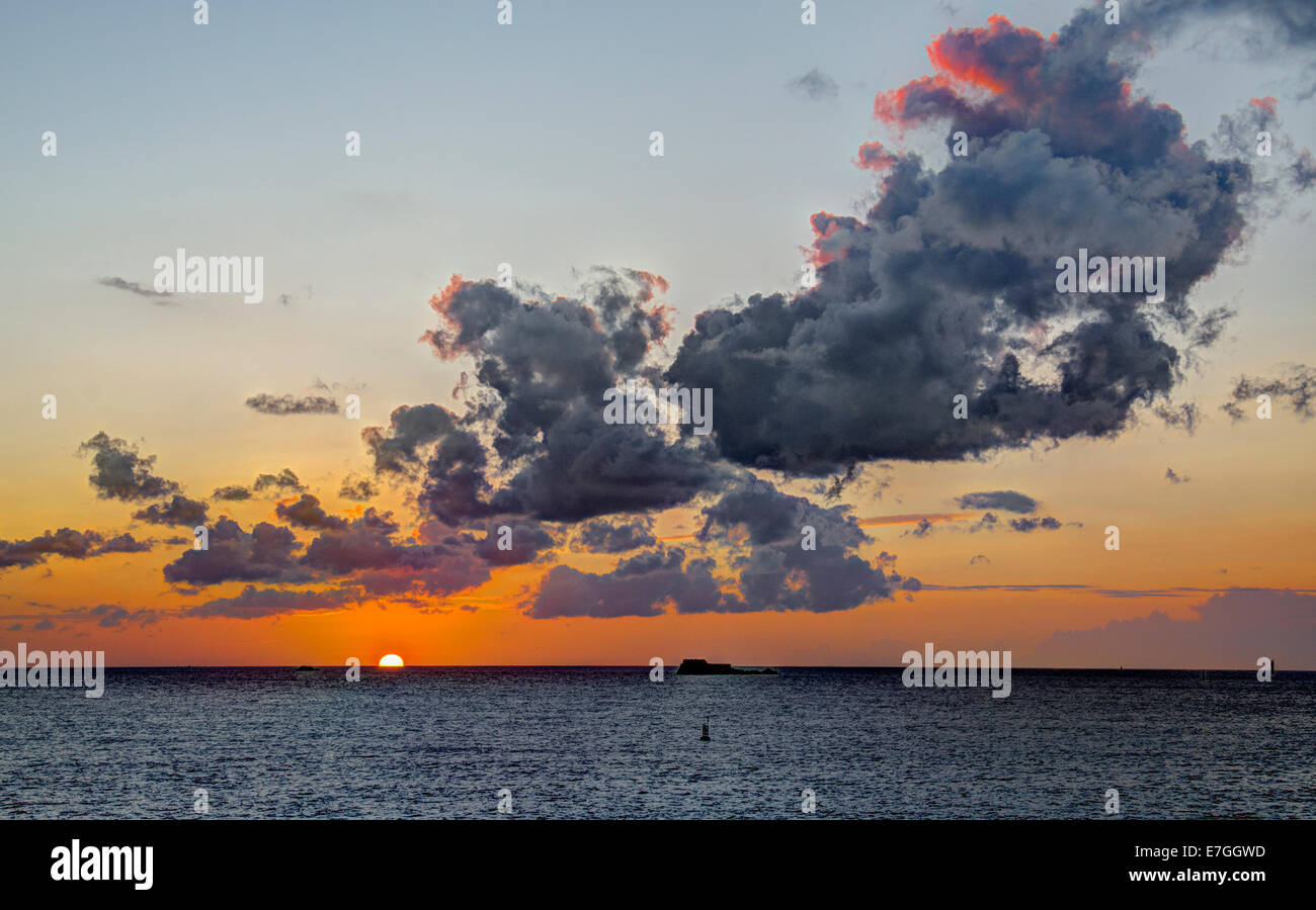 Setting sun off the coast of Brittany France Stock Photo - Alamy