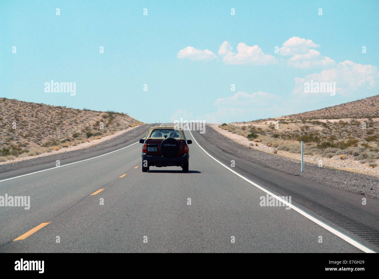 Driving on Death Valley road in the middle of desert landscape Stock ...