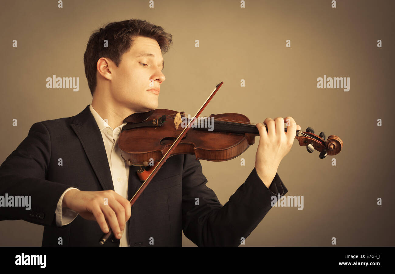 Man violinist playing violin. Classical music art Stock Photo - Alamy