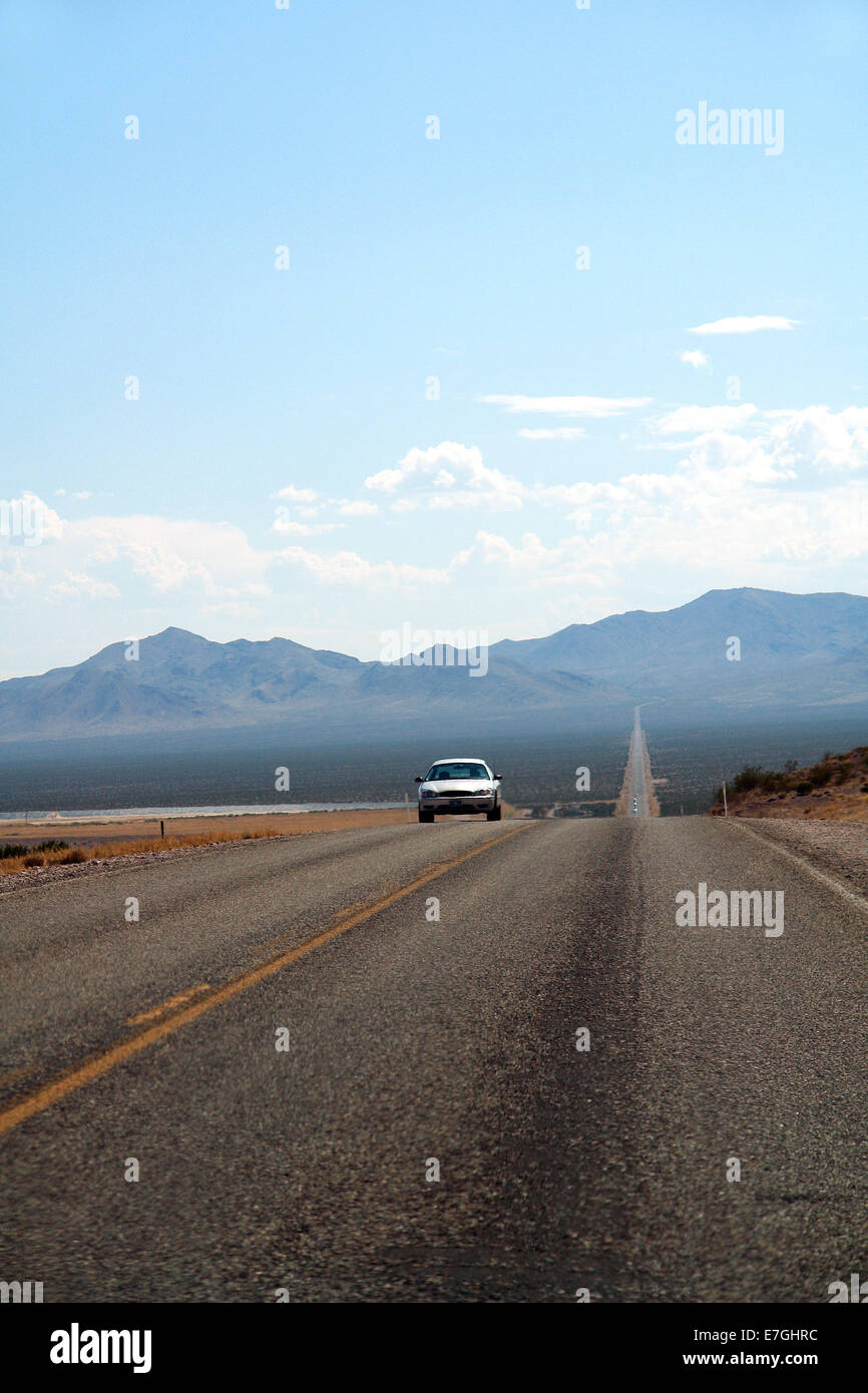 Driving on Death Valley road in the middle of desert landscape Stock ...