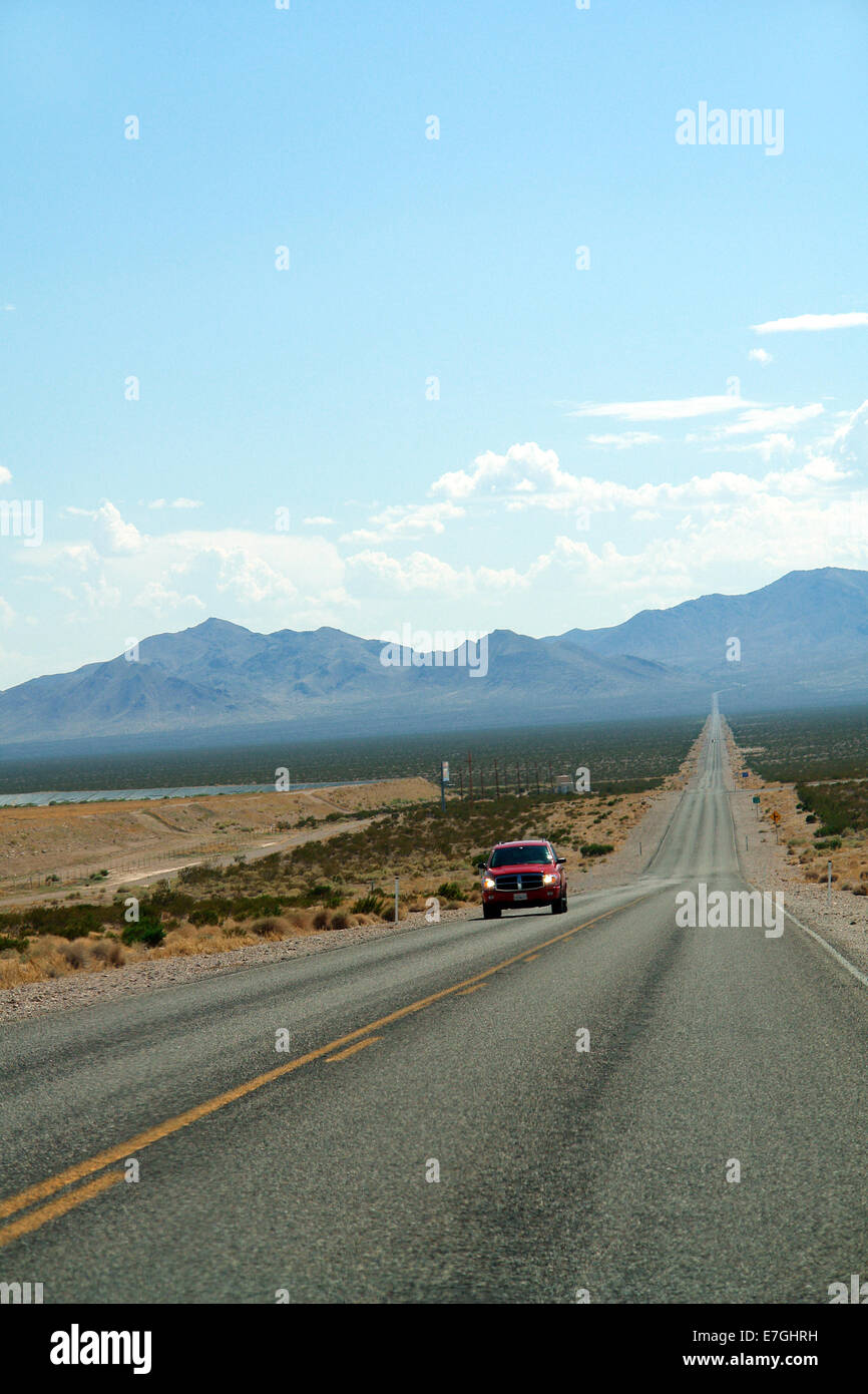 Driving on Death Valley road in the middle of desert landscape Stock ...