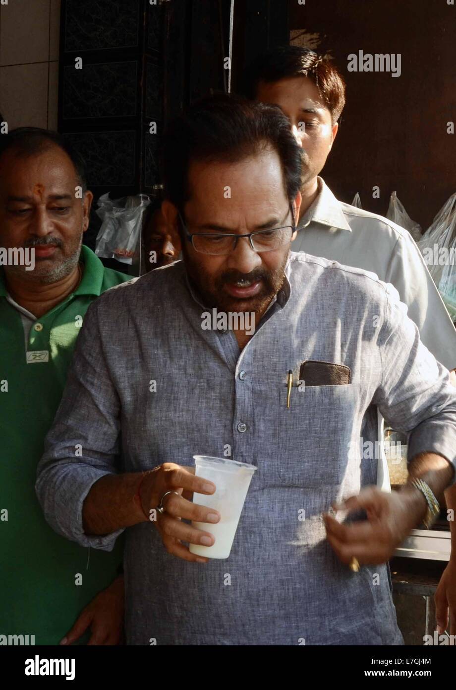 BJP leader Mukhtar Abbas Naqvi about to drink lassi during solicitation ...