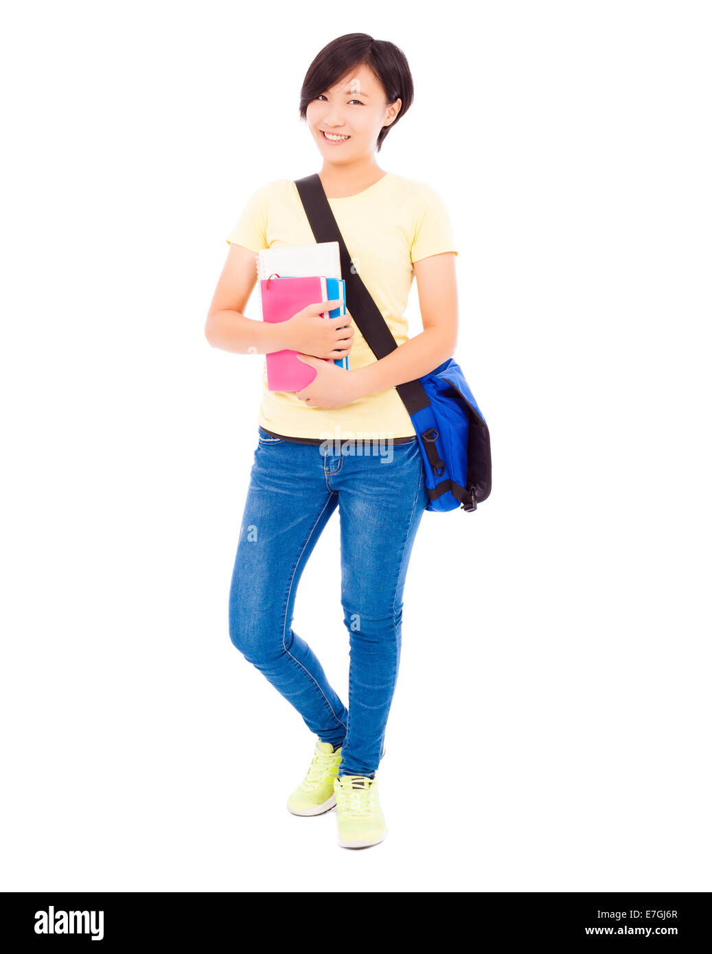 pretty university student girl standing and holding book over white ...