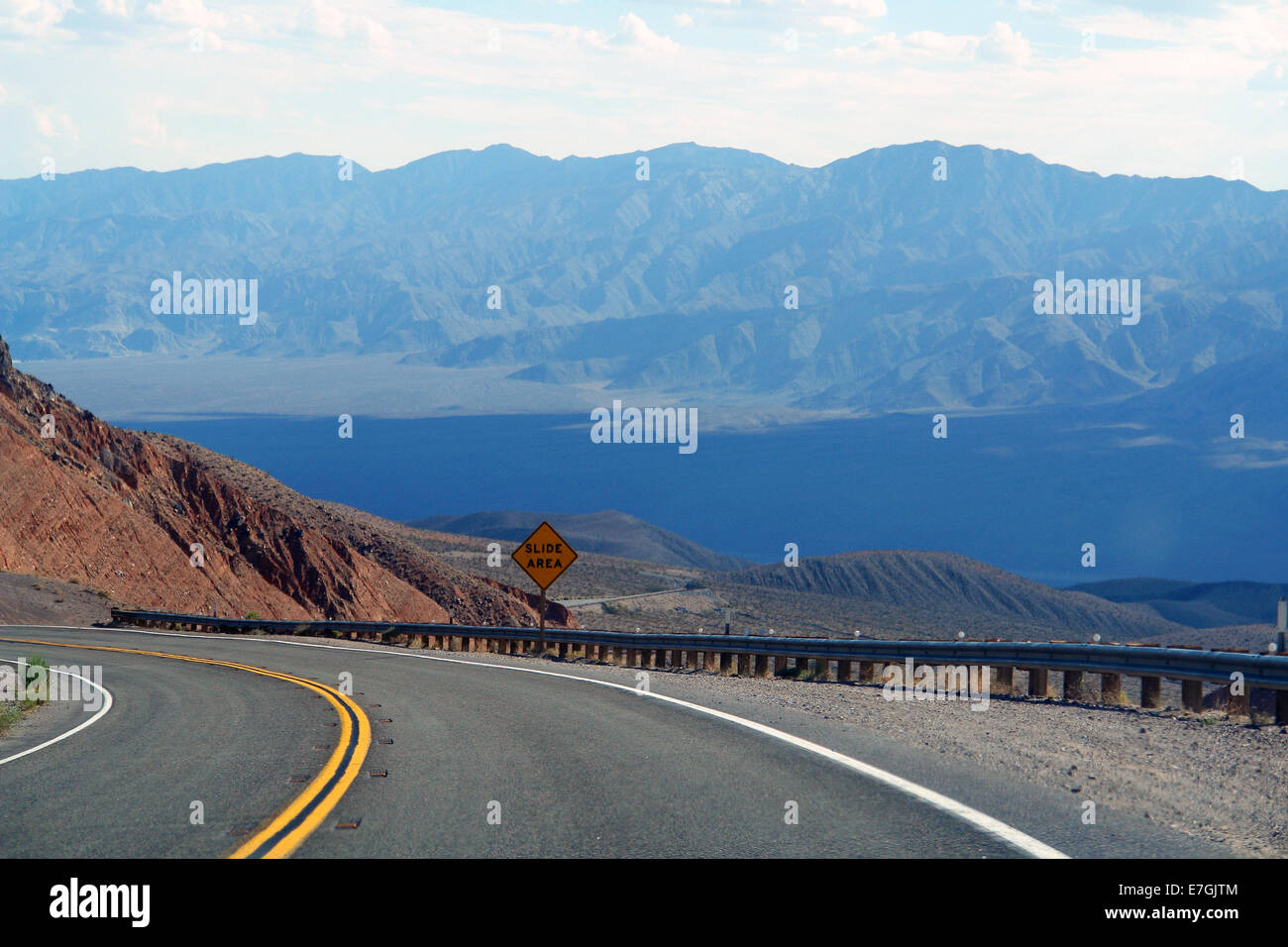 Driving on Death Valley car on the road in the middle of desert ...