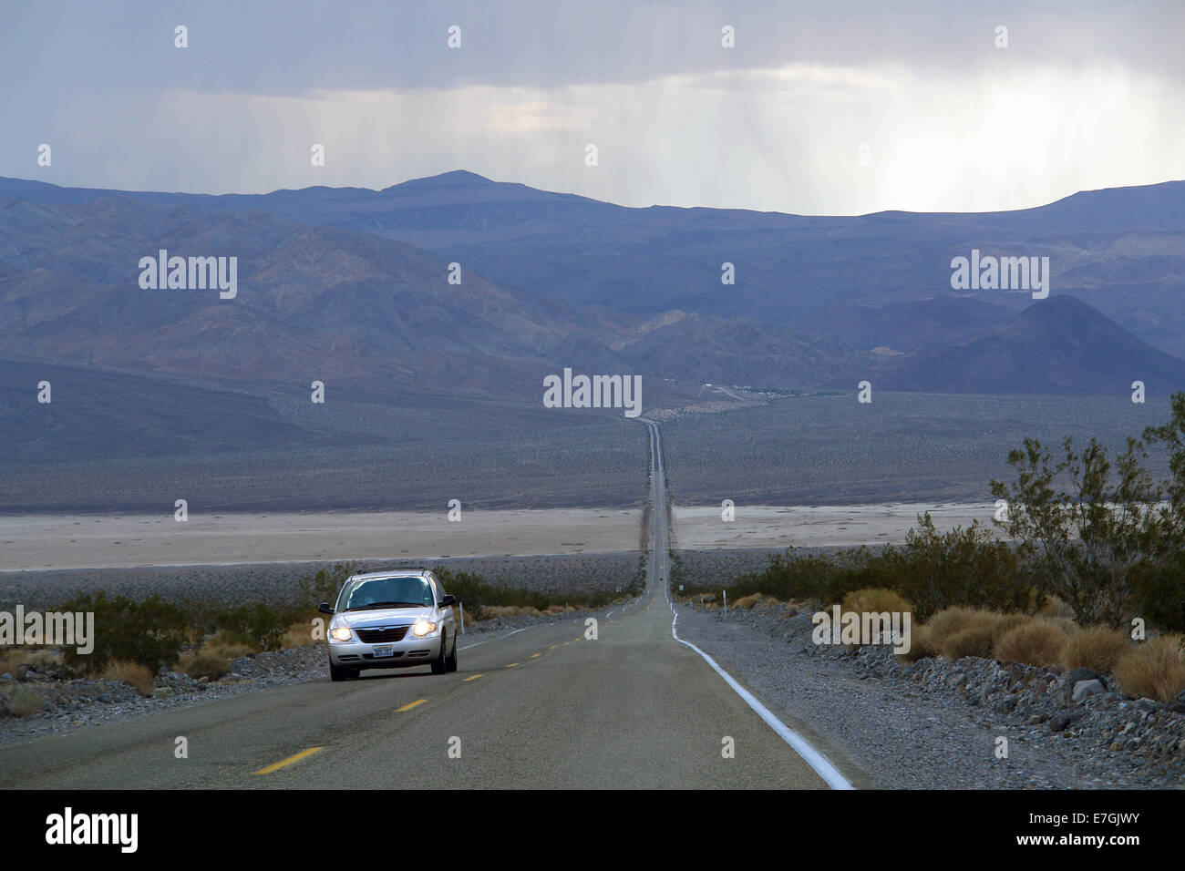 Driving on Death Valley car on the road in the middle of desert ...