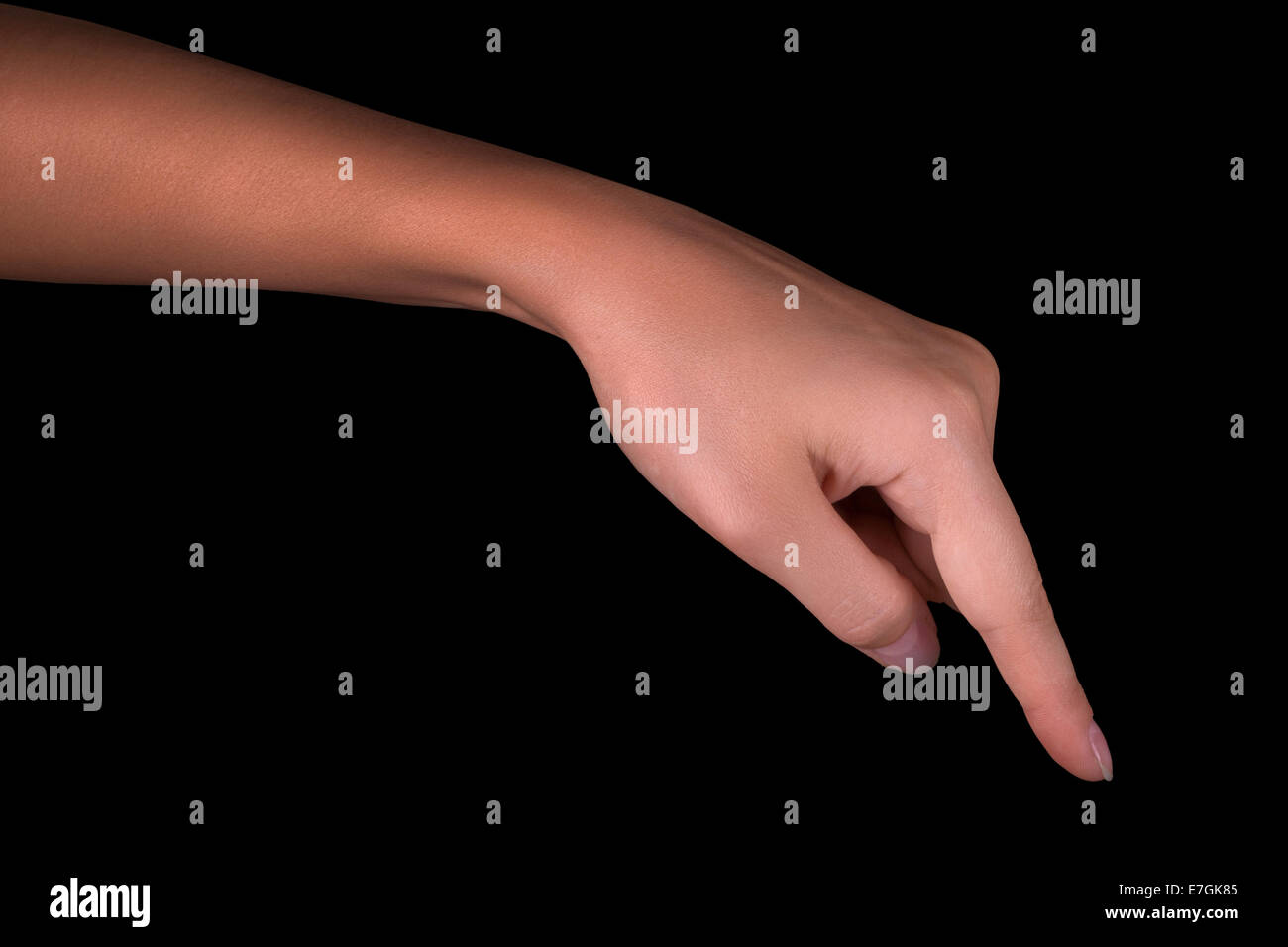 image of a woman's finger pointing or touching isolated on black ...