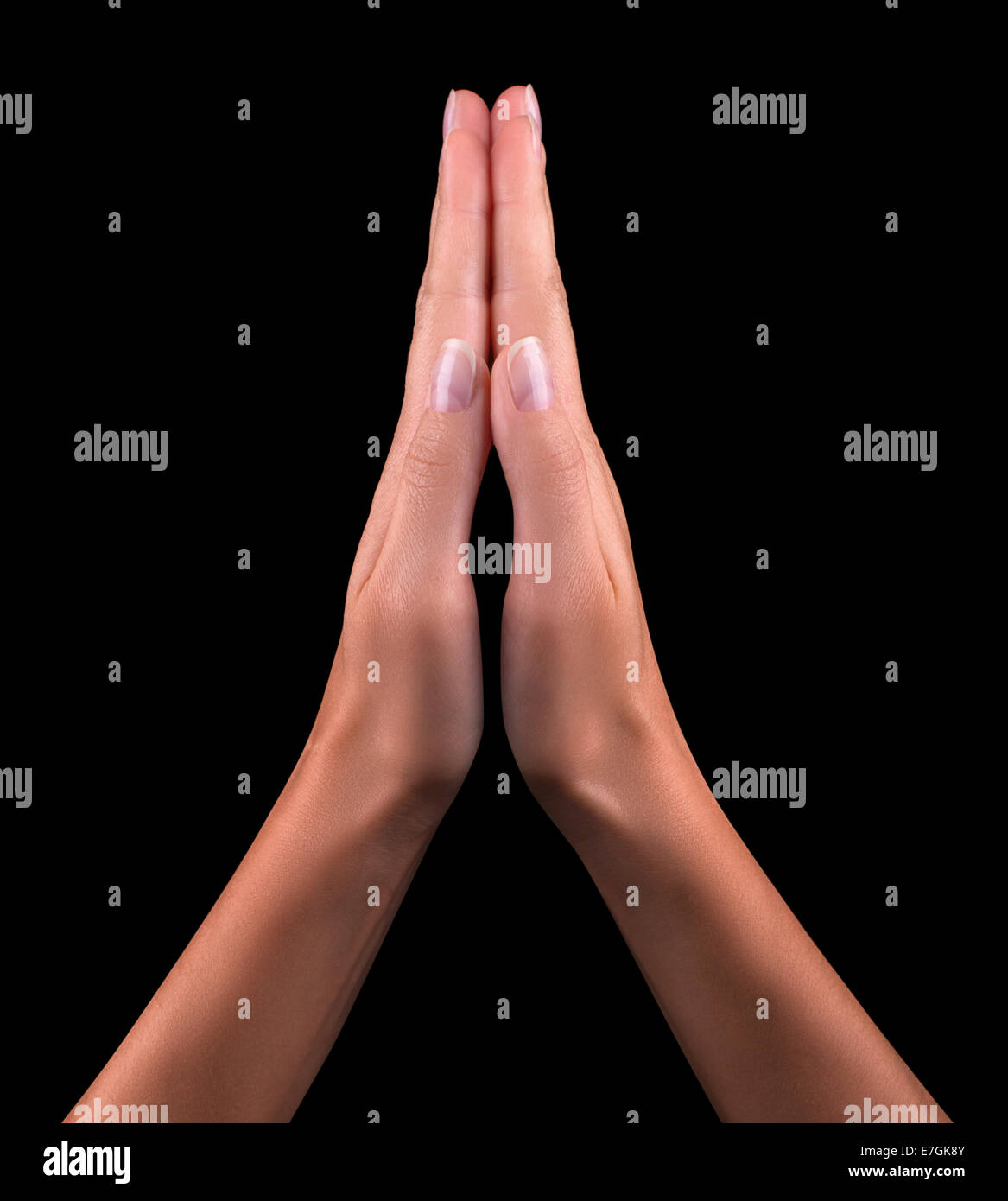 Two hands isolated on a black background, praying Stock Photo - Alamy