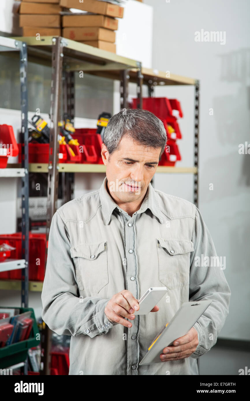 Man Scanning Product In Hardware Store Stock Photo - Alamy
