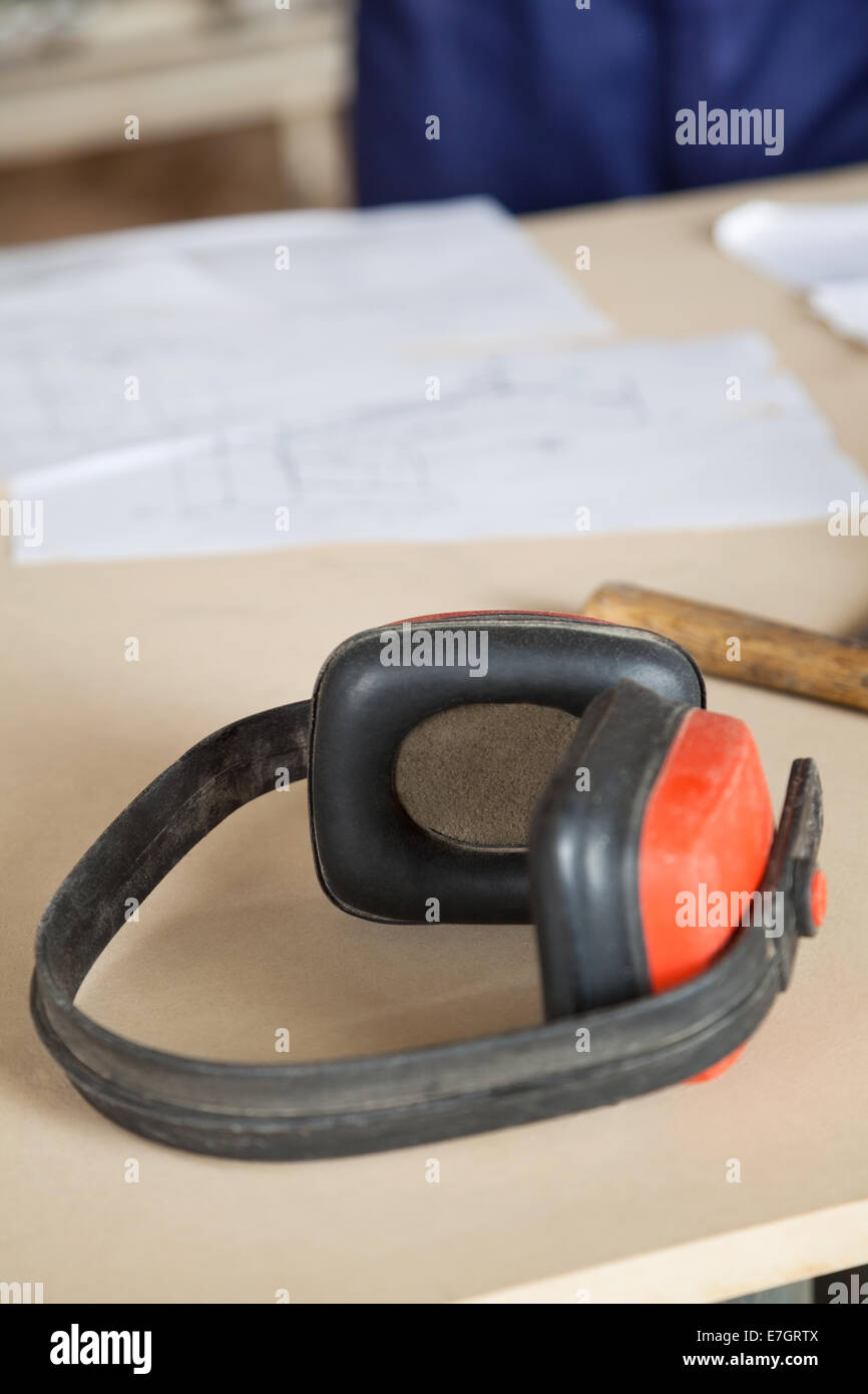 Closeup Of Ear Protectors On Wooden Table Stock Photo - Alamy