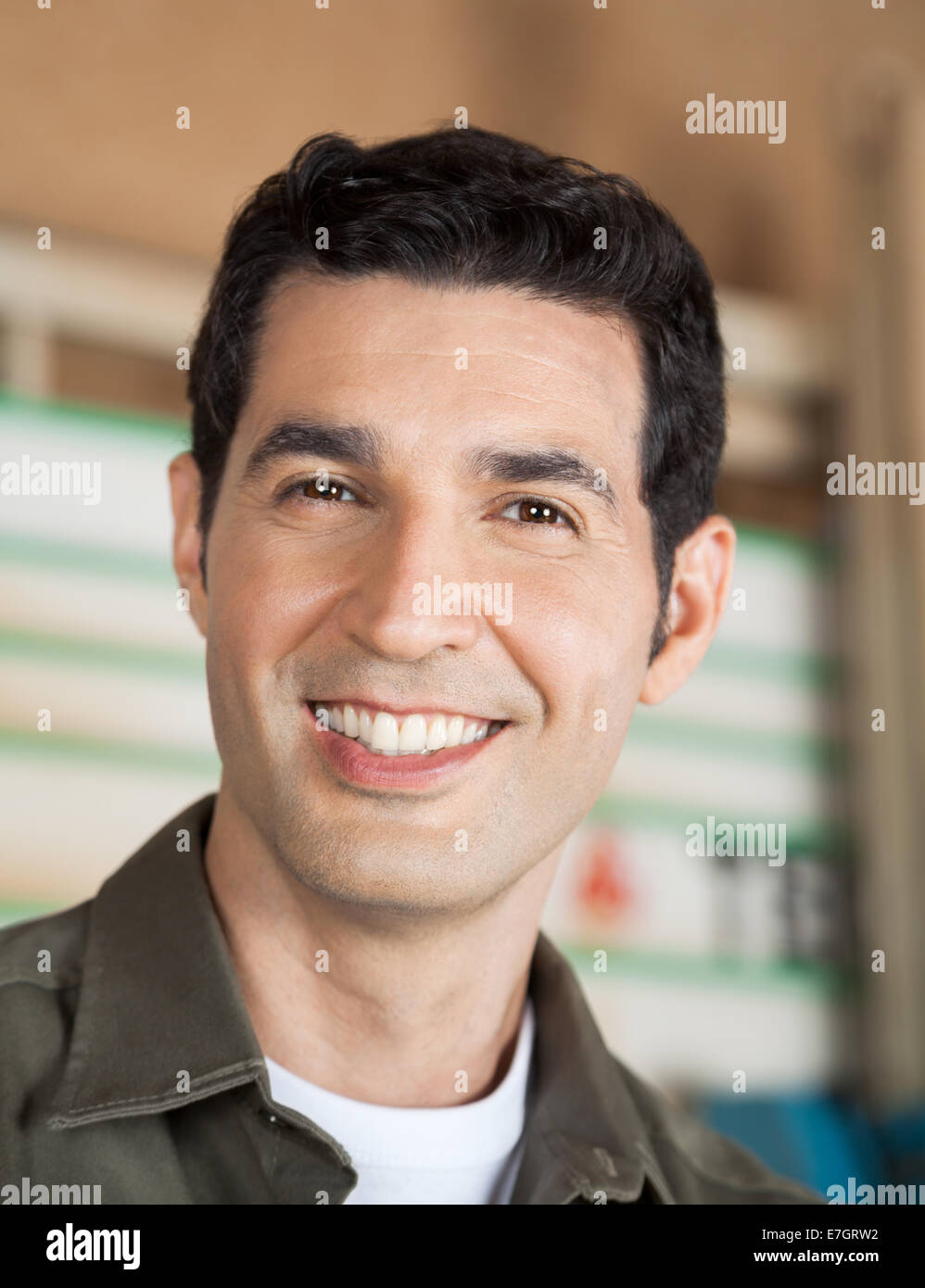 Confident Carpenter Smiling In Workshop Stock Photo - Alamy