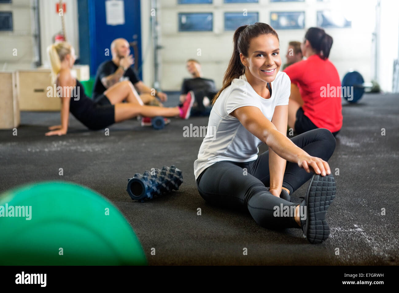 Woman Doing Stretching Exercise At Cross Training Box Stock Photo - Alamy