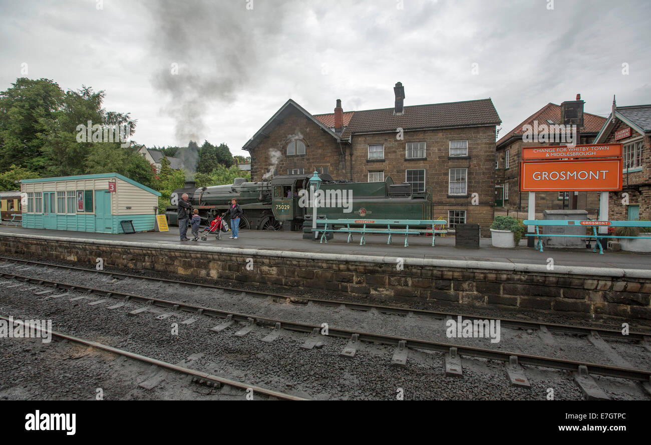 Steam train and historic locomotive at Grosmont railway station on ...