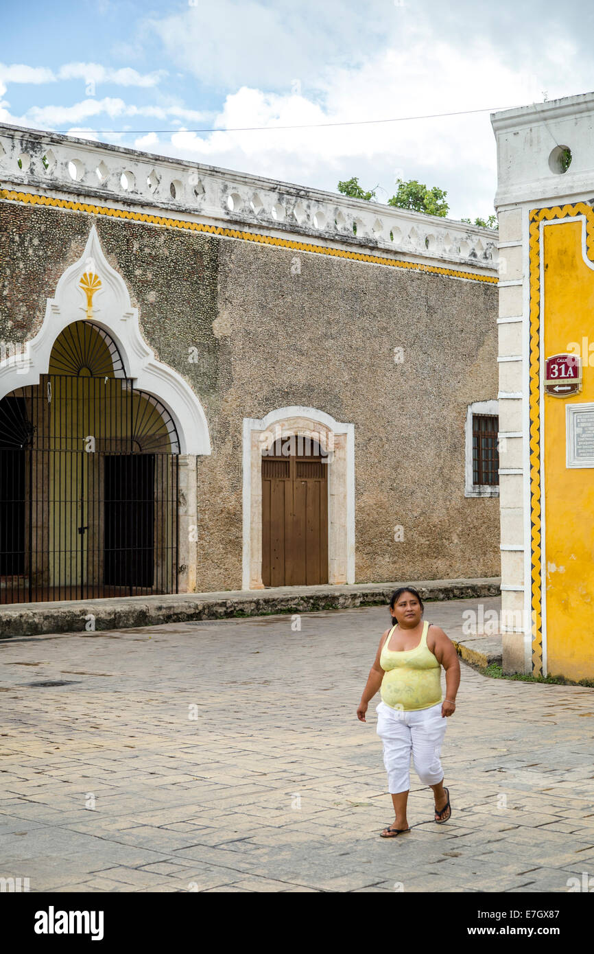 mayan woman crossing old colonial street in a small town in yucatan ...