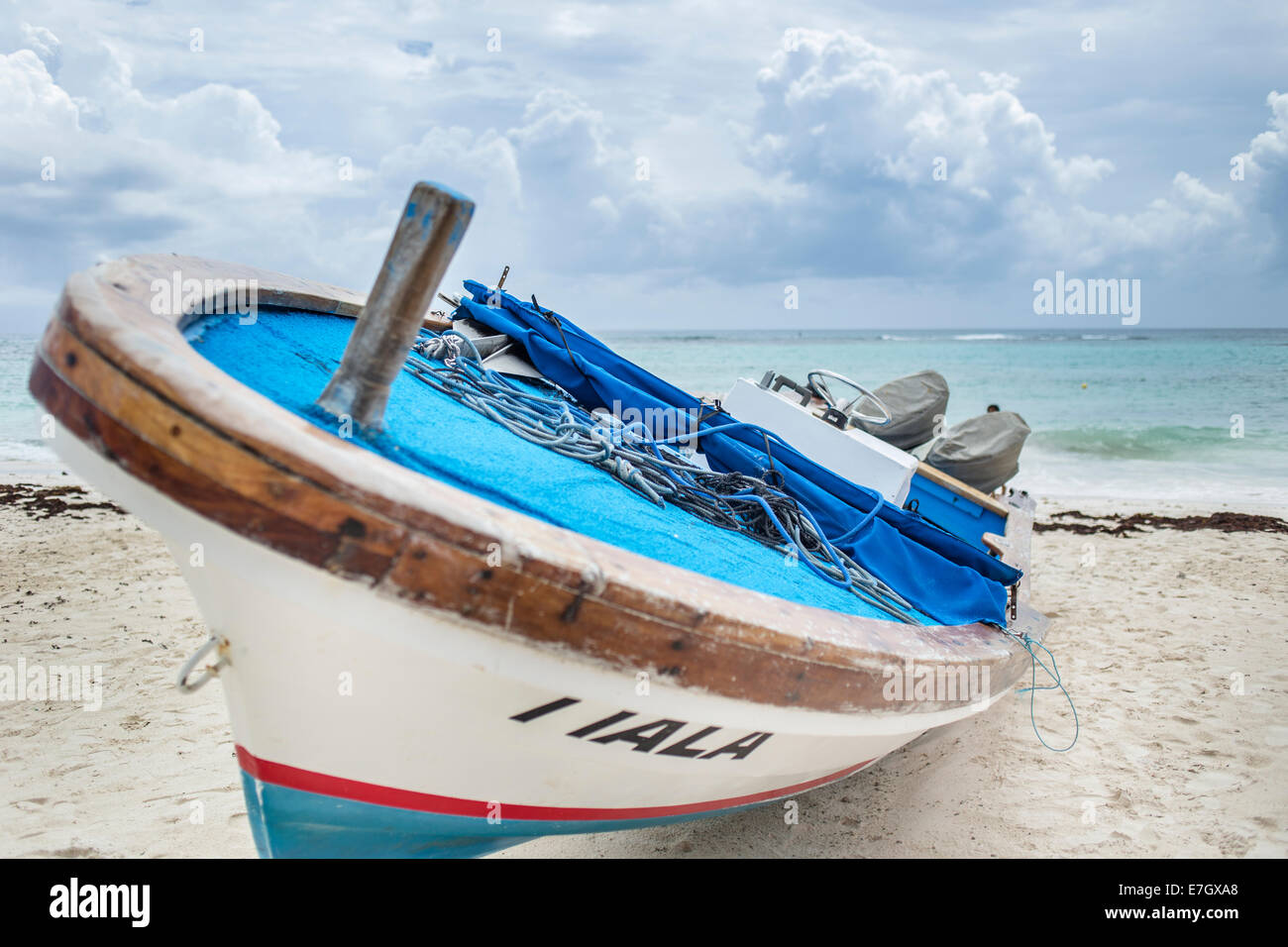 a fishing boat on a beach in mexico Stock Photo - Alamy