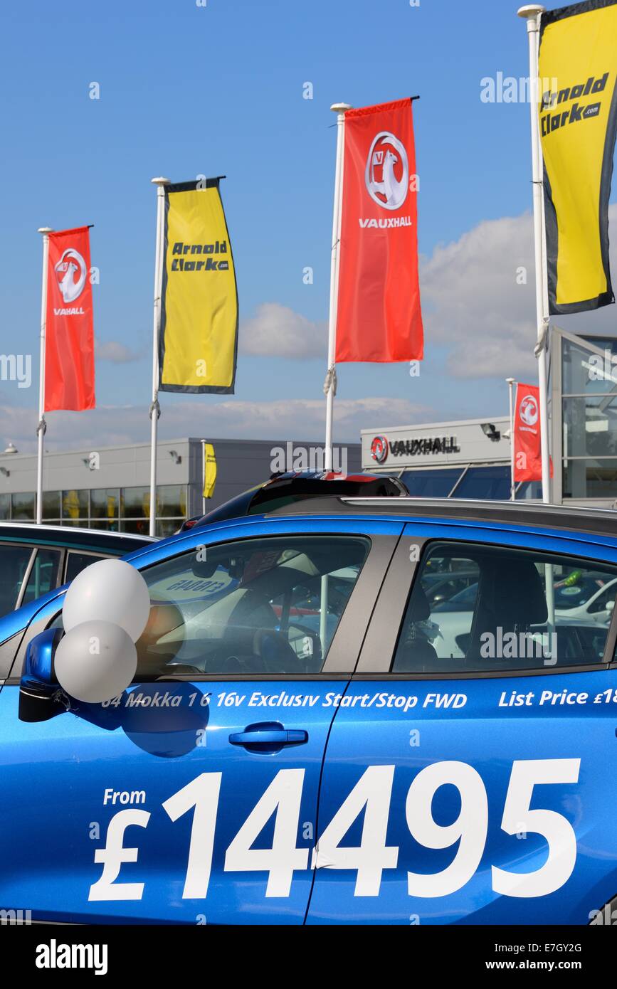 Car sales forecourt with flags and balloons in Linwood, Scotland, UK ...