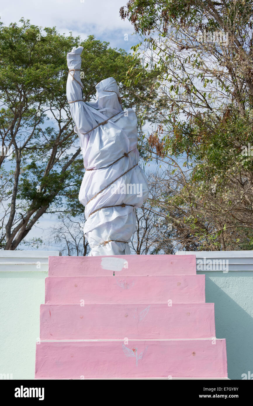 A statue of a politician covered during an election in Tamil Nadu ...