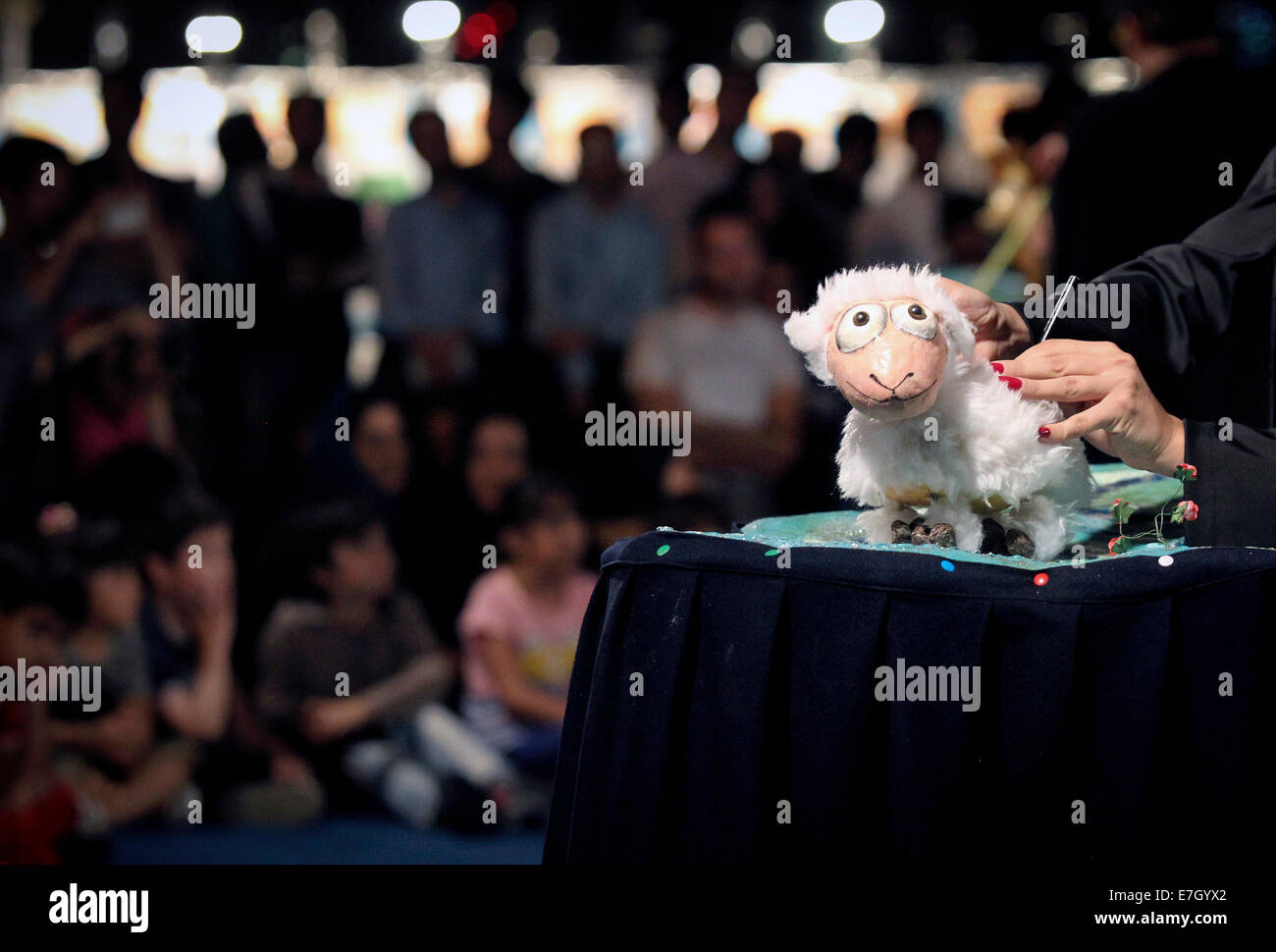 Tehran, Iran. 17th Sep, 2014. An Iranian actor performs a puppet show ...