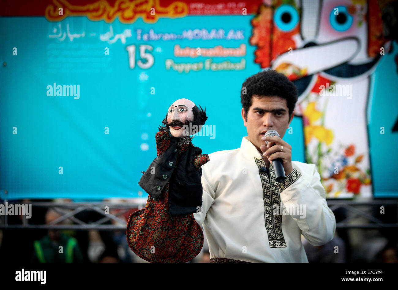Tehran, Iran. 17th Sep, 2014. An Iranian actor performs a puppet show ...