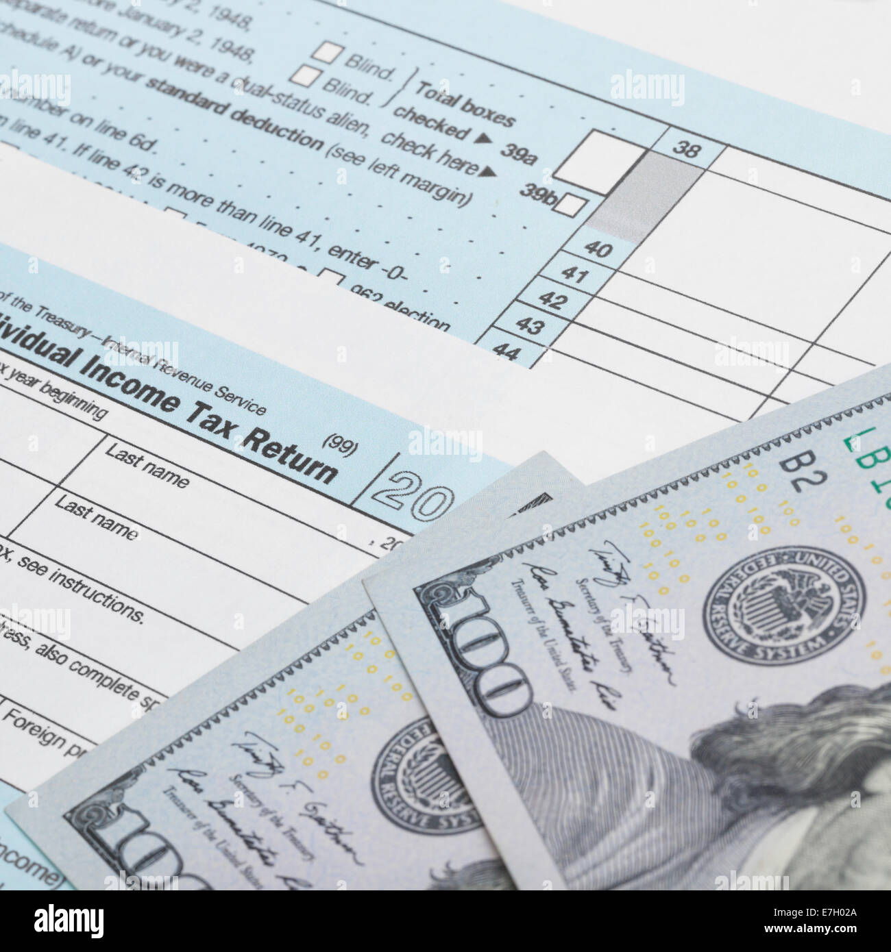USA Tax Form 1040 with 100 US dollar bills - 1 to 1 ratio Stock Photo ...