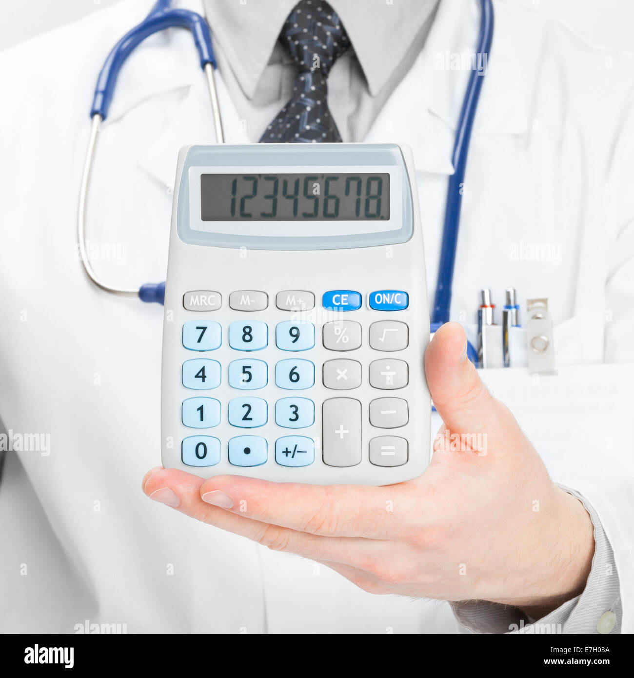 Medical doctor with calculator in his hand - heath care concept - 1 to ...