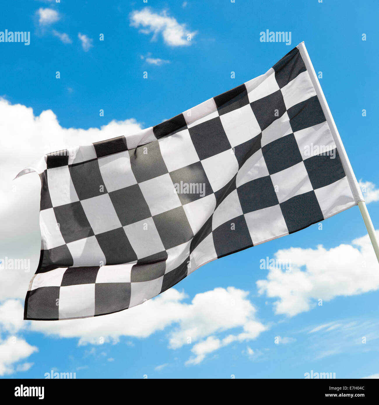 Race flag waving in the wind with white clouds on background - outdoors ...