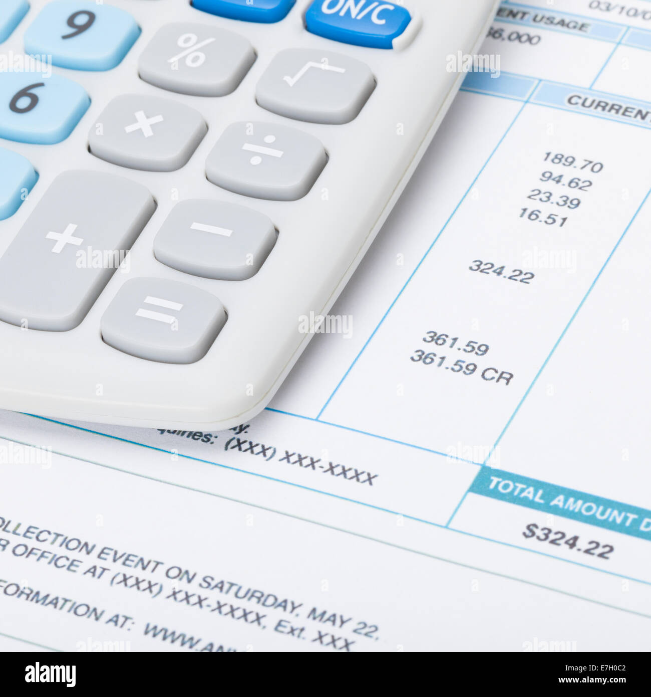 Receipt next to calculator - studio shot - 1 to 1 ratio Stock Photo - Alamy