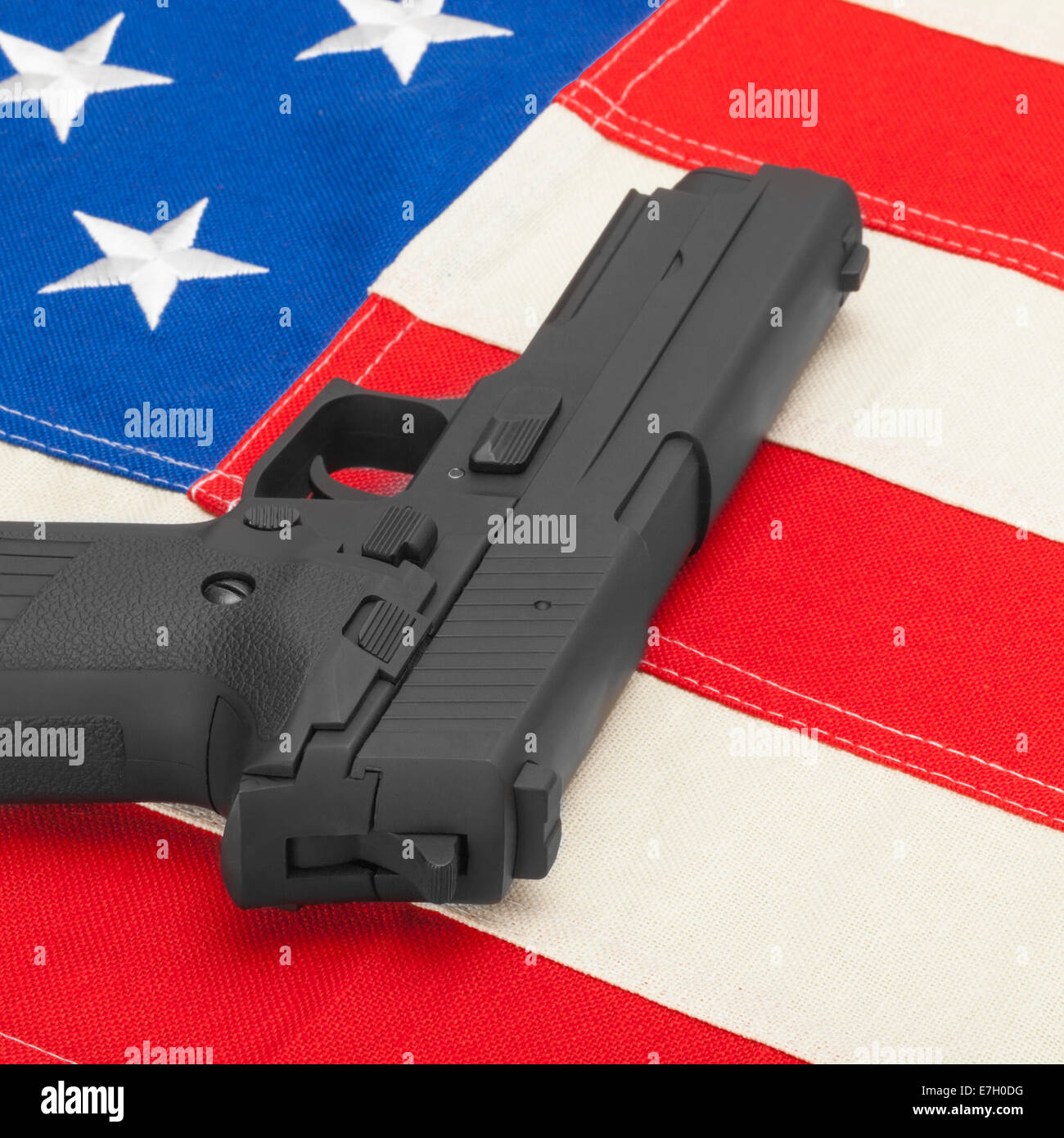 Handgun laying over USA flag - studio shoot - 1 to 1 ratio Stock Photo ...