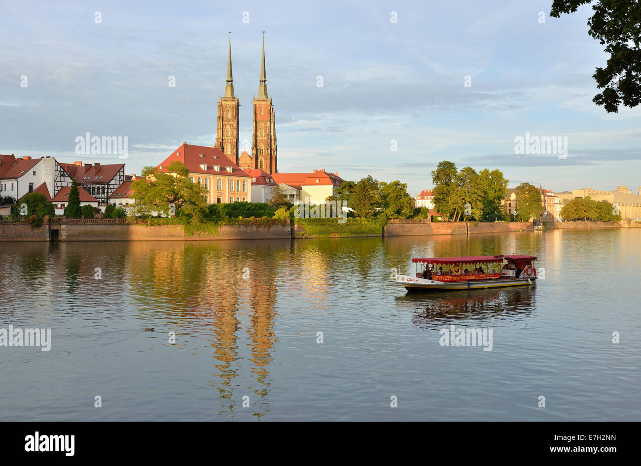 Ostrow Tumski island on river Oder with the Cathedral and tourist boat ...