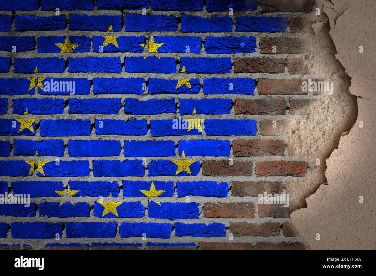 Dark brick wall texture with plaster - flag painted on wall - EU Stock ...