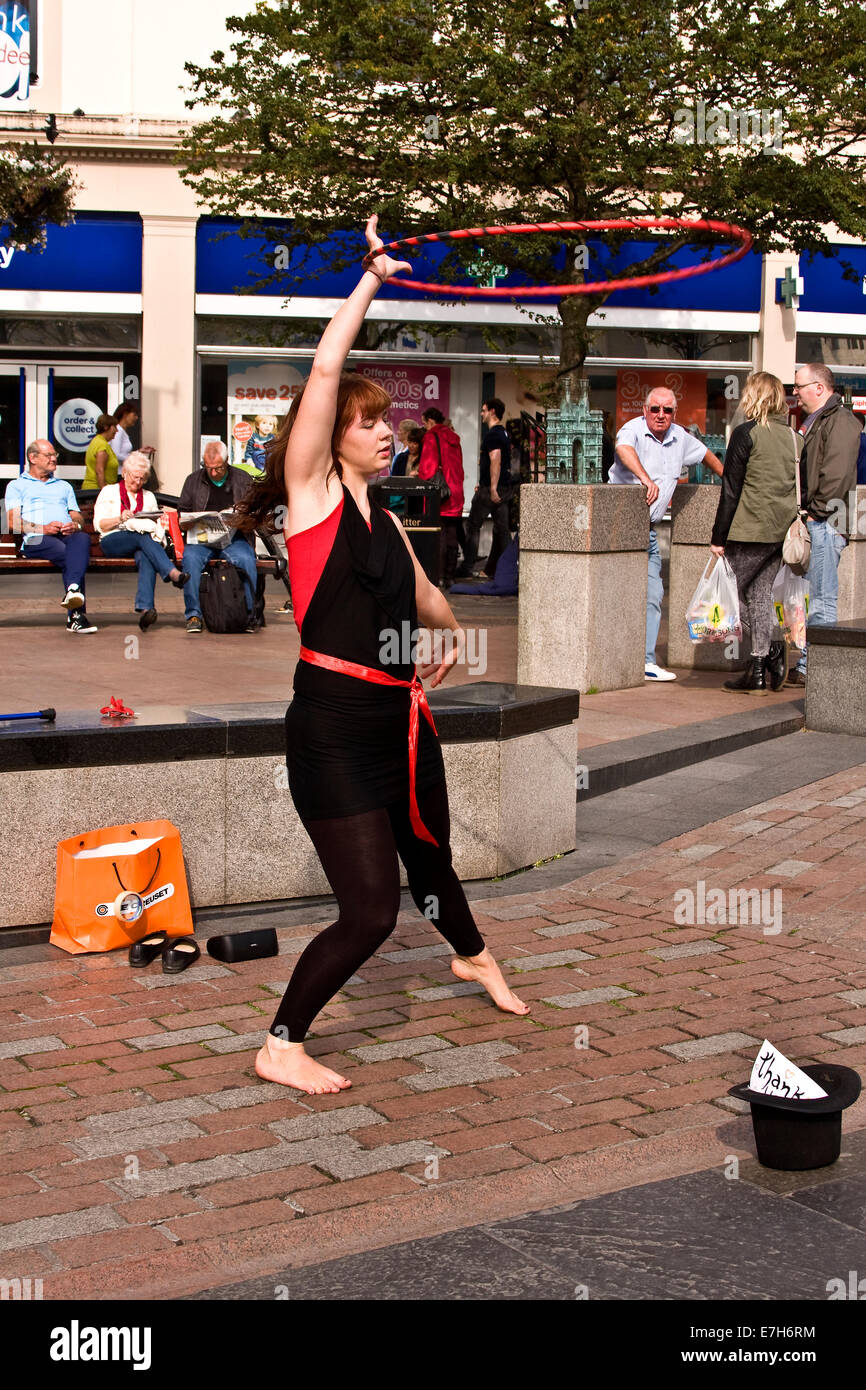An attractive young woman dancing with her Hula Hoop in Dundee City ...