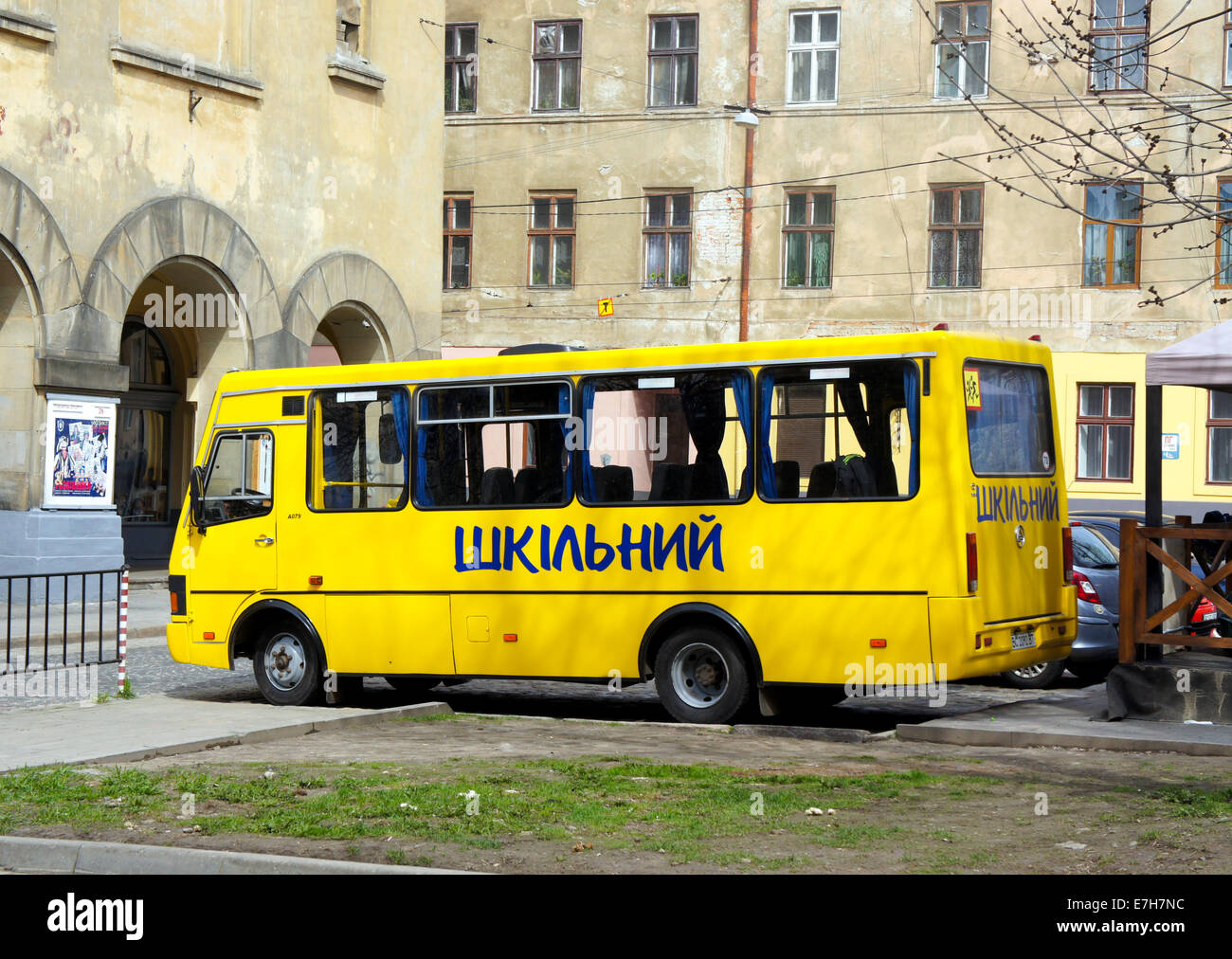 Yellow school bus on the street in Lviv Stock Photo - Alamy
