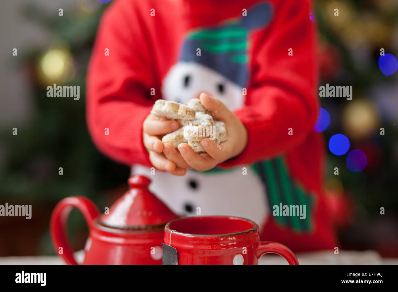 Boy holding cookies Stock Photo - Alamy
