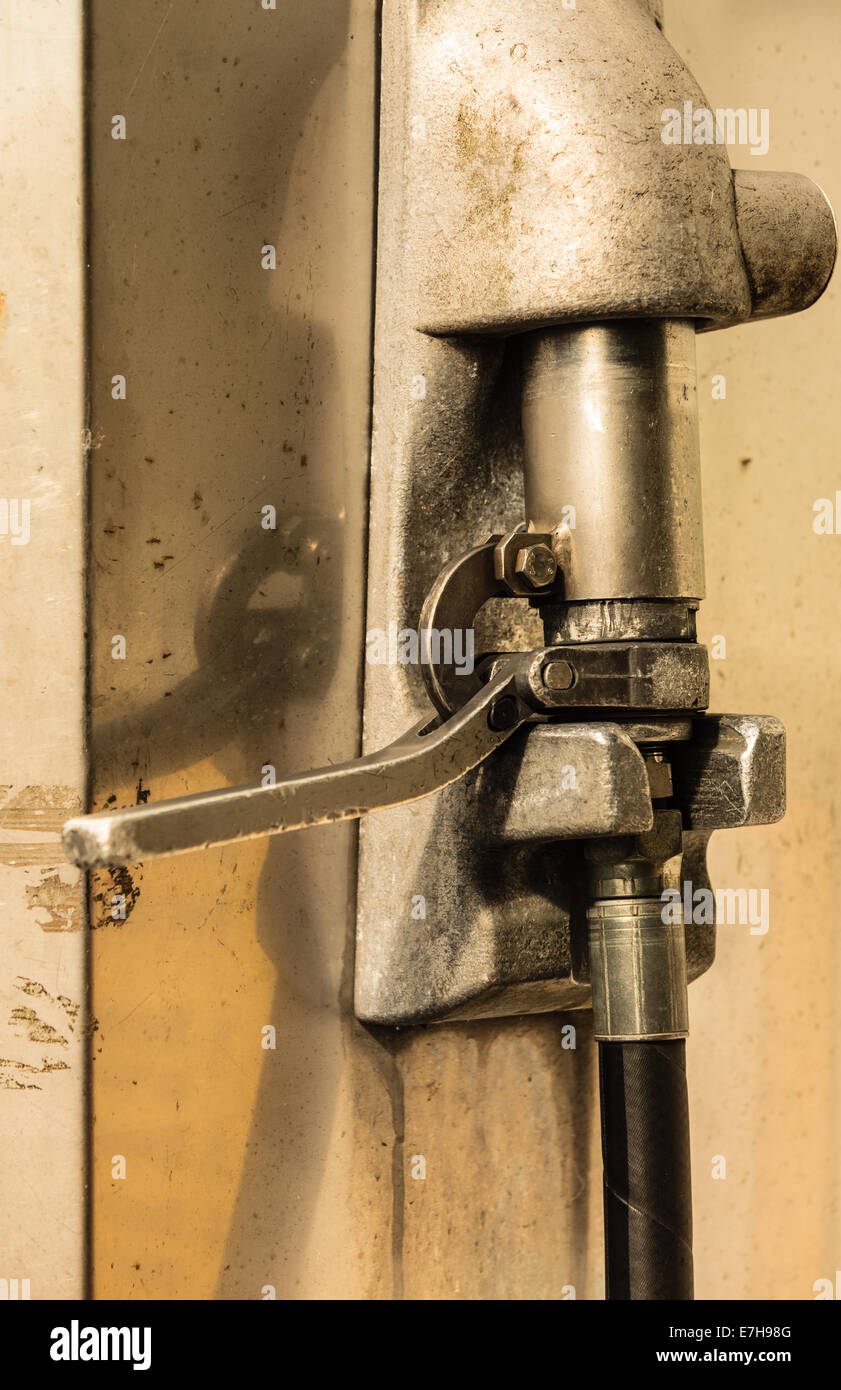 Gas pump close up with nozzle in service station Stock Photo - Alamy