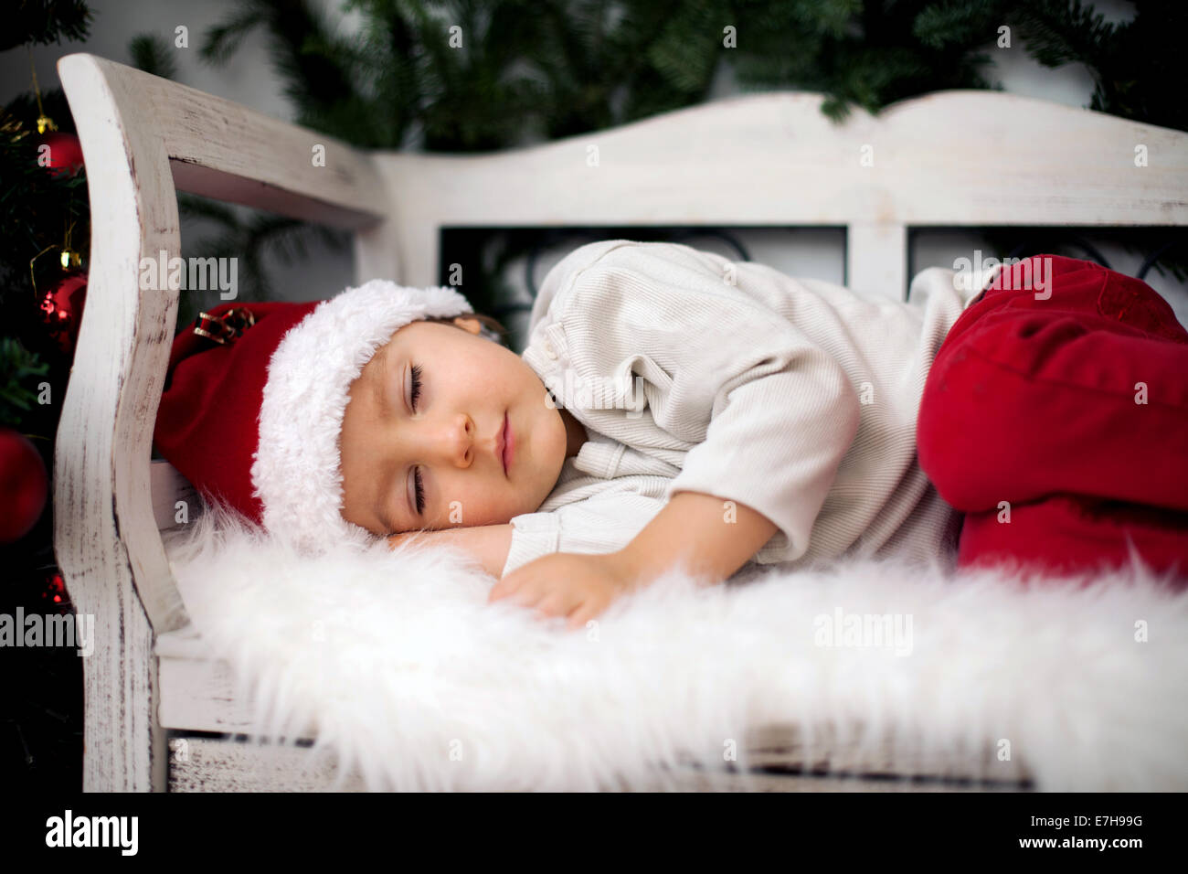 Boy sleeping on bench hi-res stock photography and images - Alamy