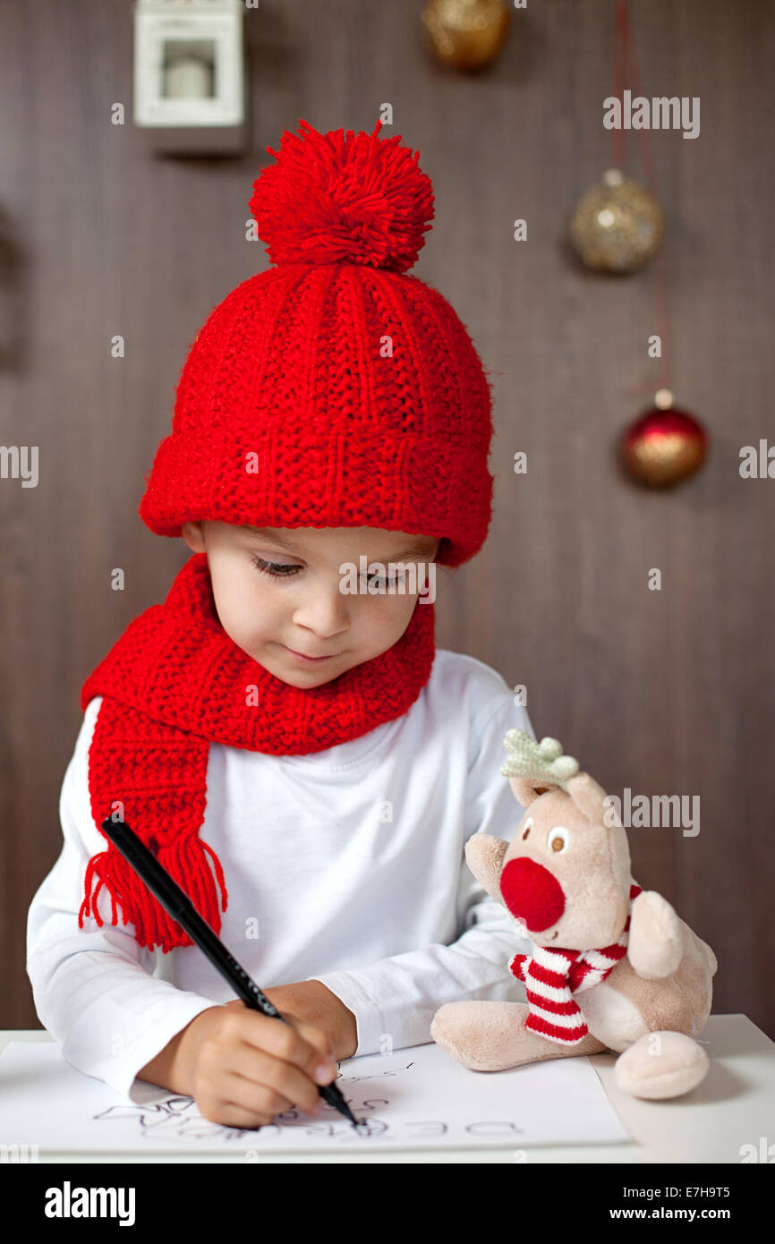Adorable little boy, writing letter to Santa Stock Photo - Alamy