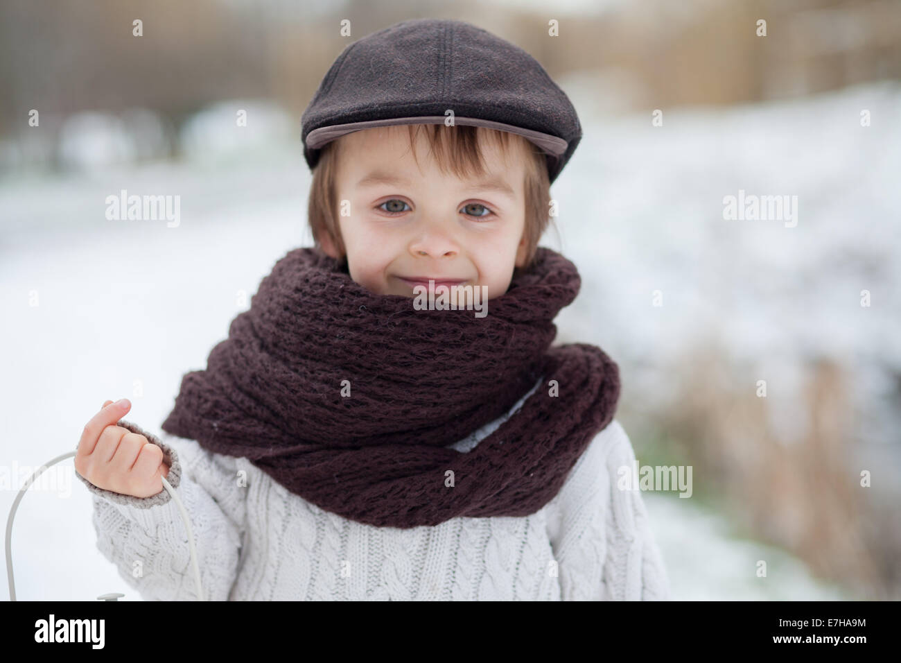 Boy outside in the snow Stock Photo - Alamy
