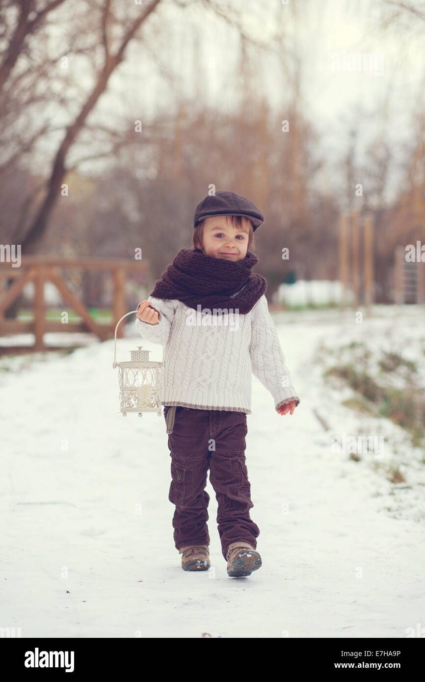 Boy outside in the snow Stock Photo - Alamy