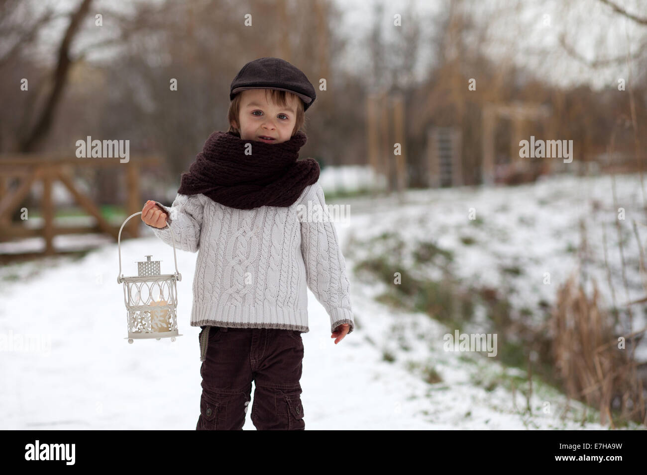 Boy outside in the snow Stock Photo - Alamy