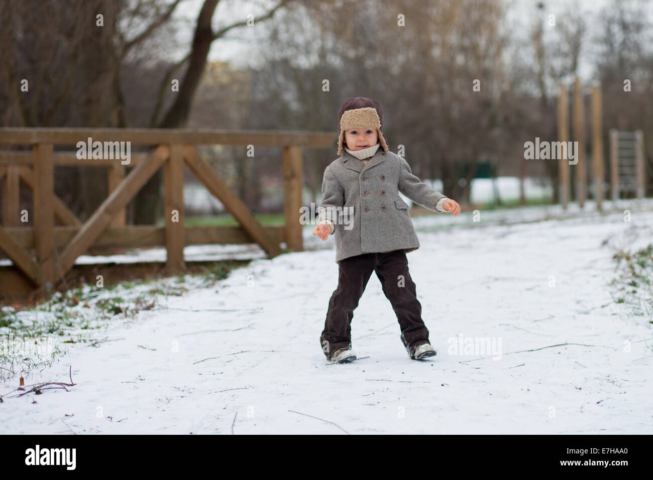 Boy outside in the snow Stock Photo - Alamy