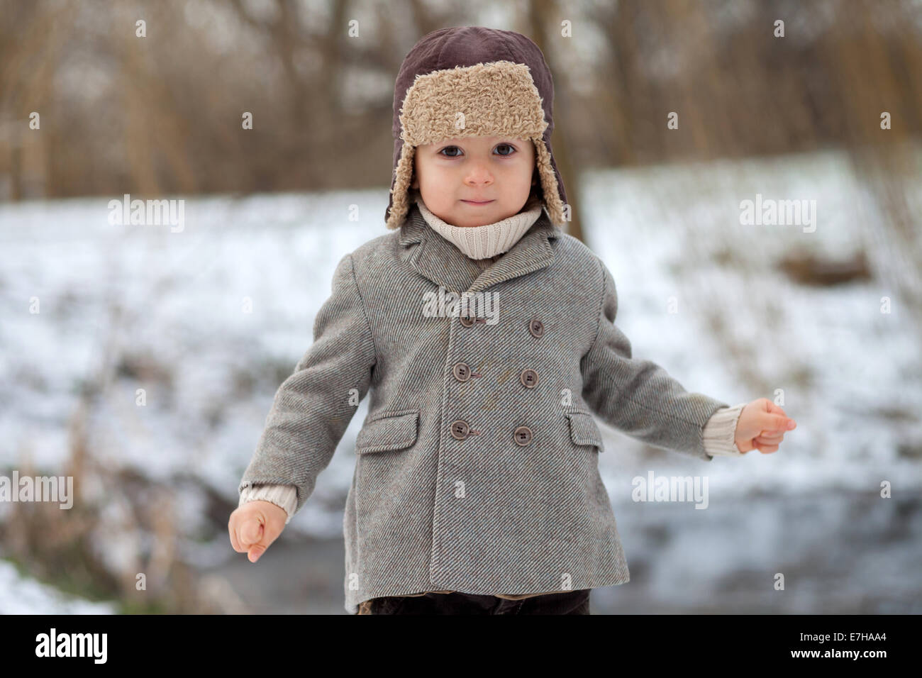 Boy outside in the snow Stock Photo - Alamy