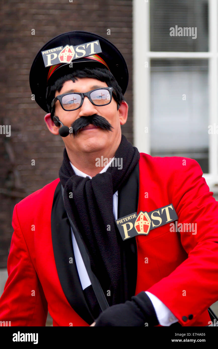 DORDRECHT, THE NETHERLANDS - NOVEMBER 18: Man dressed as the postman of ...