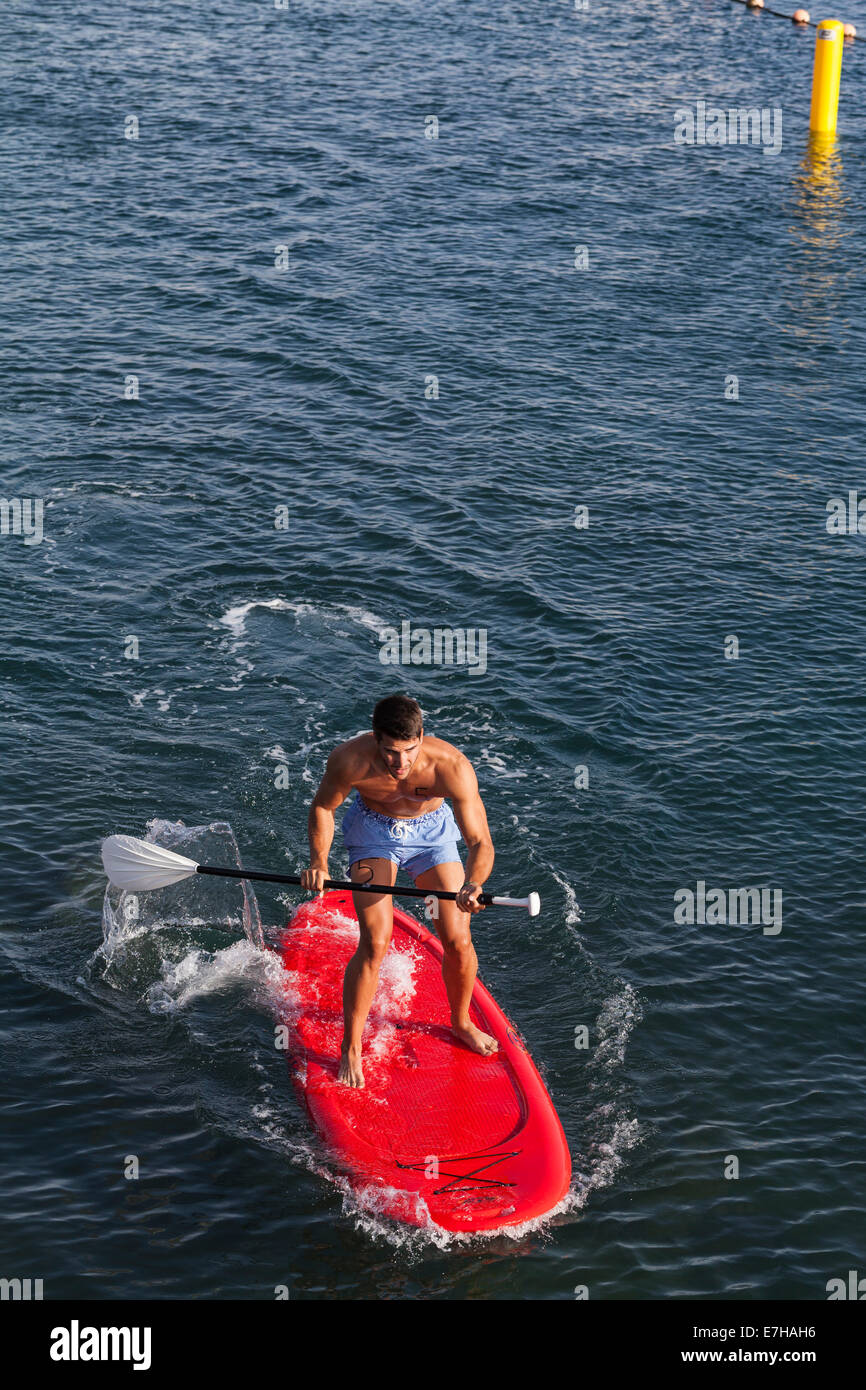 Mister International Espana contestants take part in a paddle board ...