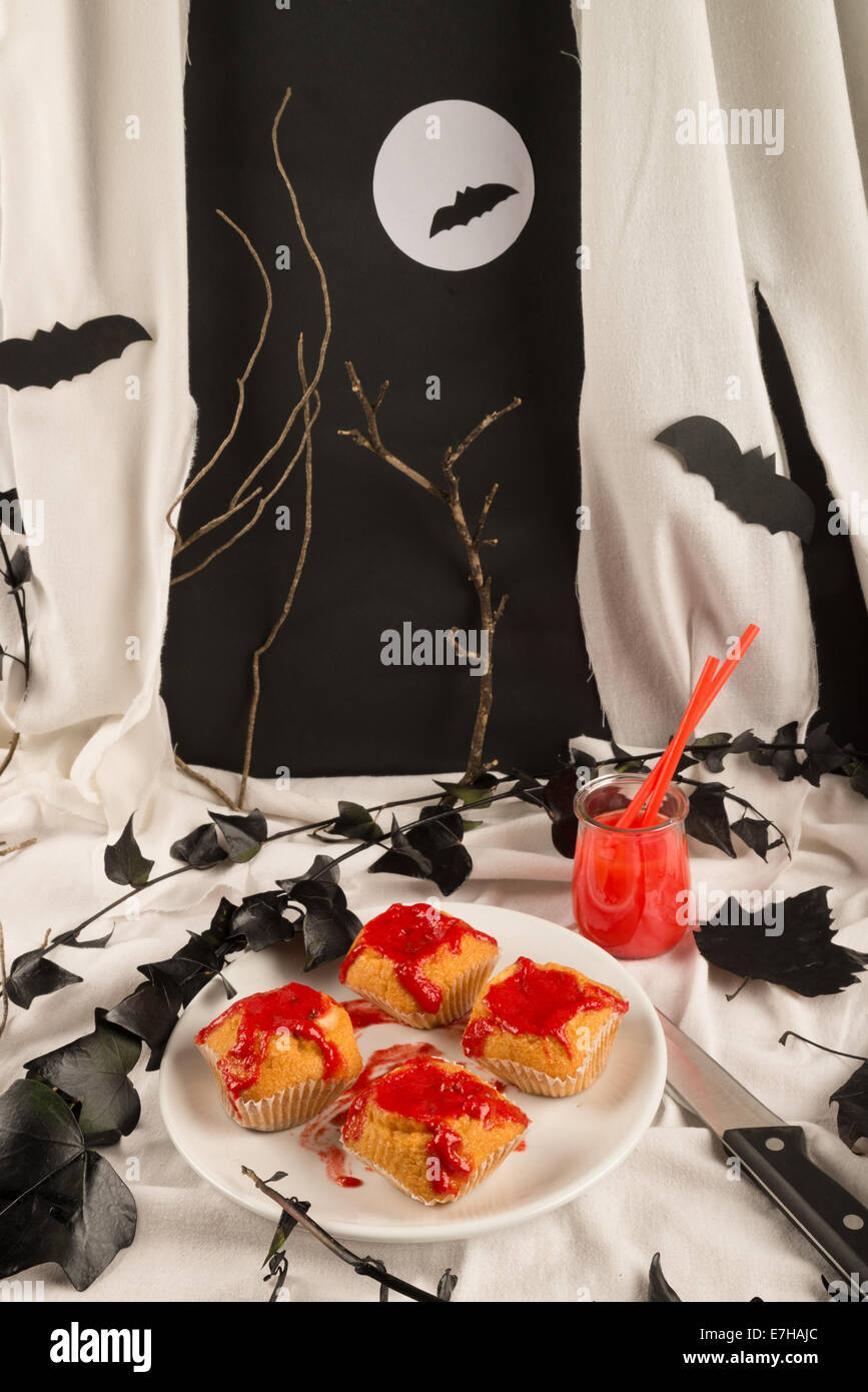 Spooky Halloween muffins with a deep red sauce Stock Photo - Alamy