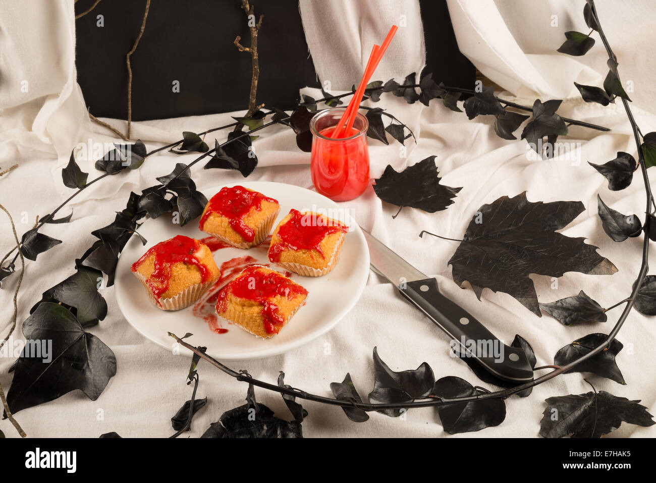 Spooky table decoration with Halloween kid party food Stock Photo - Alamy