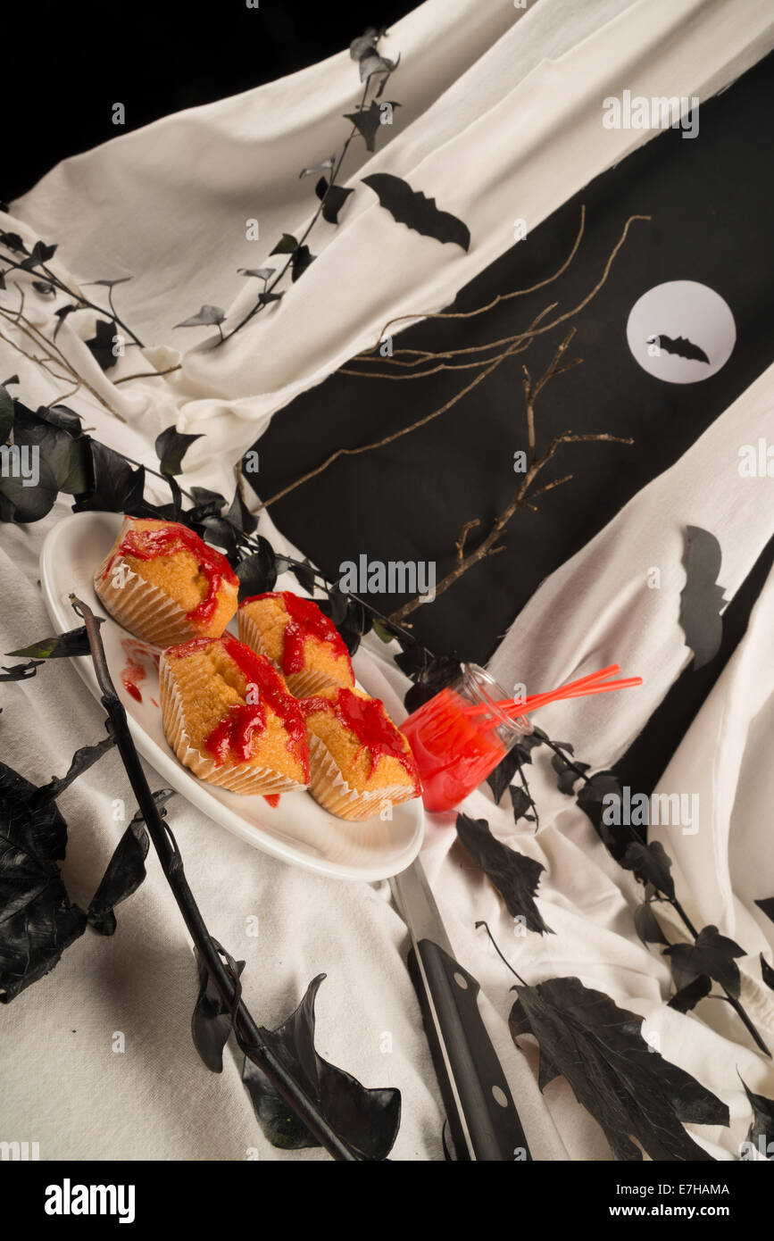 Spooky Halloween muffins with a deep red sauce Stock Photo - Alamy