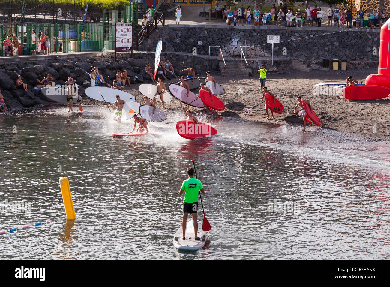 Mister International Espana contestants take part in a paddle board ...